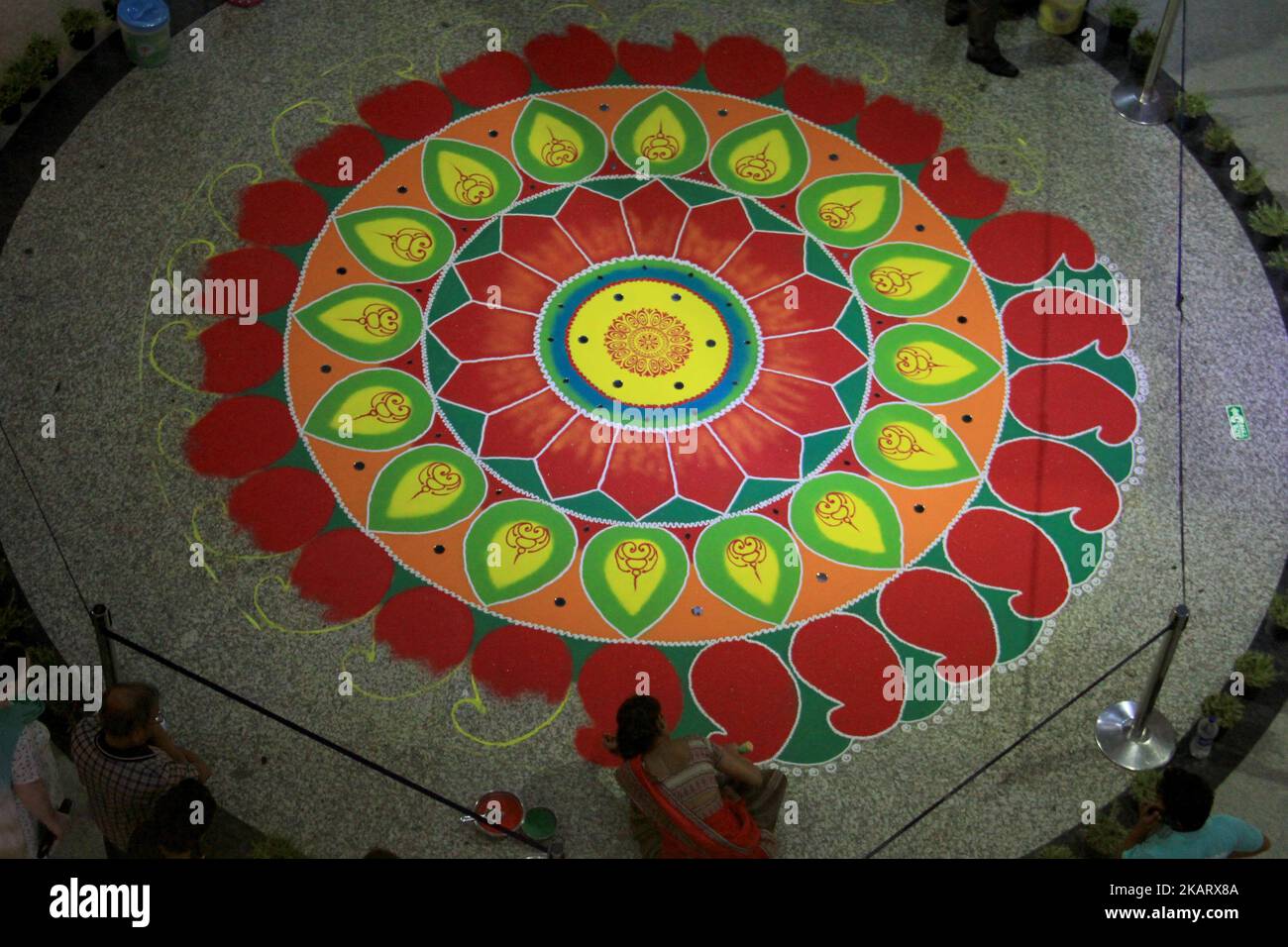 An artist prepares Rangoli ahead of the auspicious occasion of Diwali ...