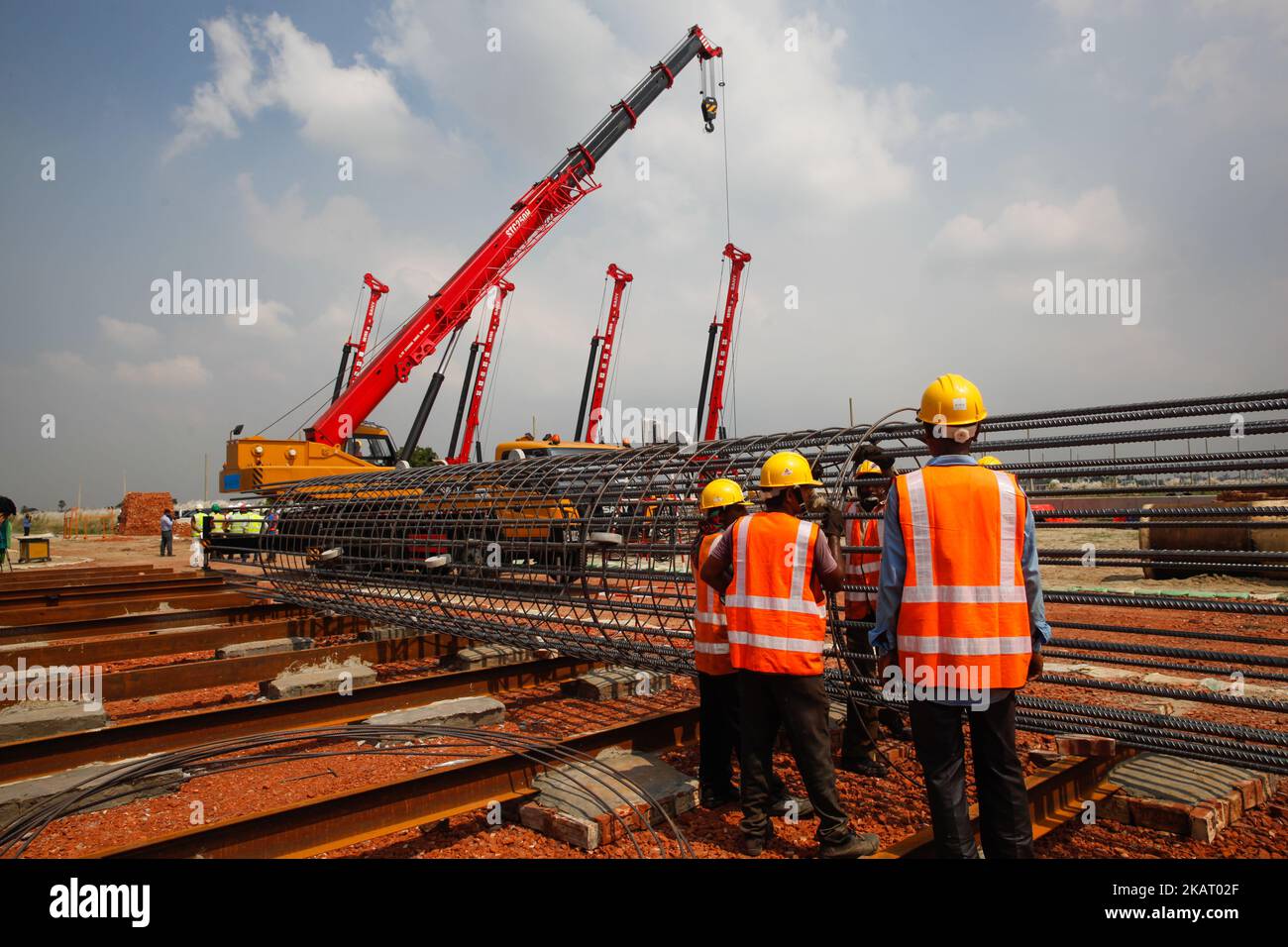 Bangladeshi construction workers working at the construction site of ...