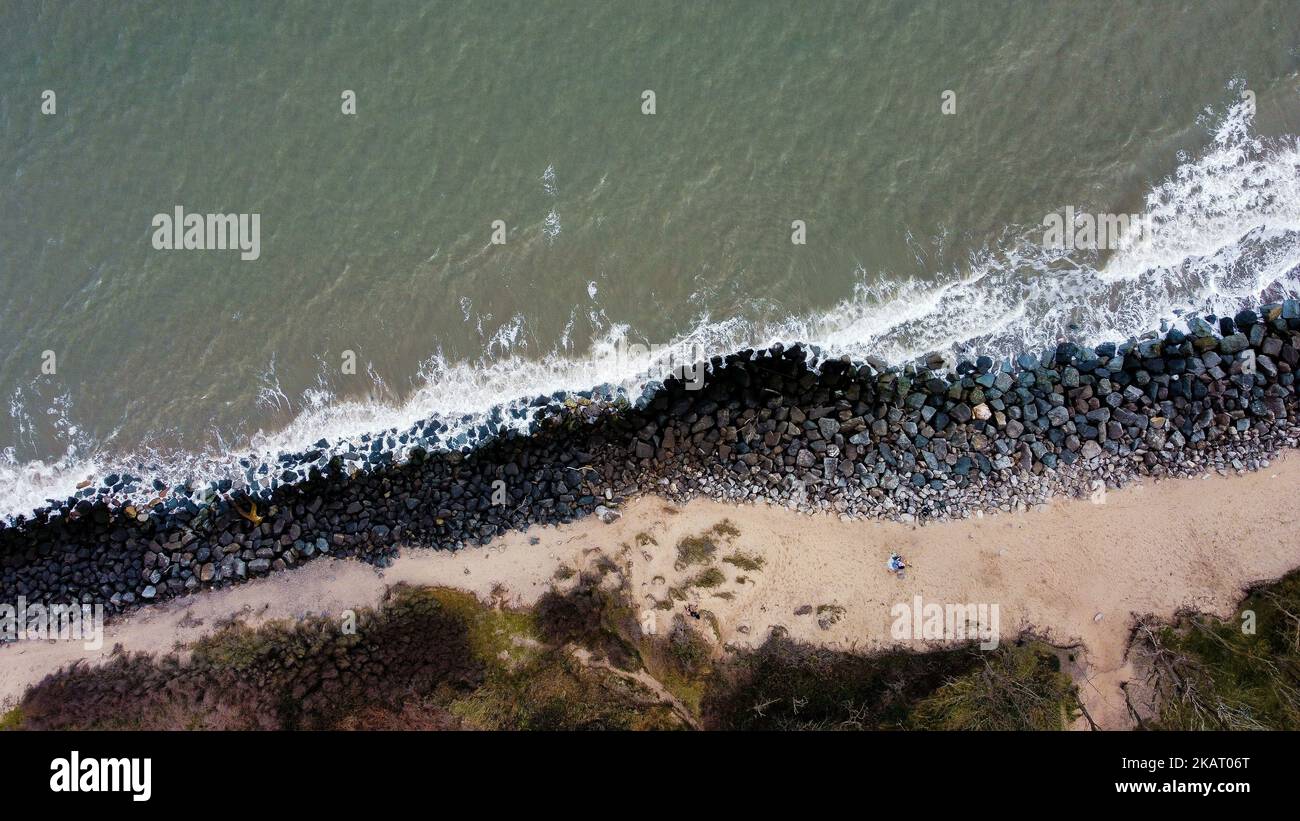 An aerial view of the waves hitting the coast in the UK Stock Photo - Alamy