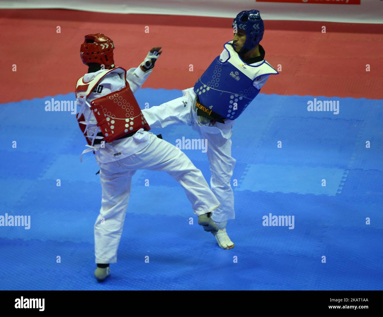 Ahmad Narimani of Iran (Blue) against Biswajit Ray of India (Red) in ...