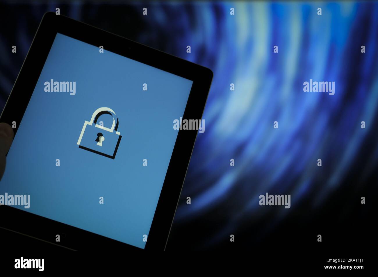 A computer tablet with a security lock symbol is seen in this photo ...