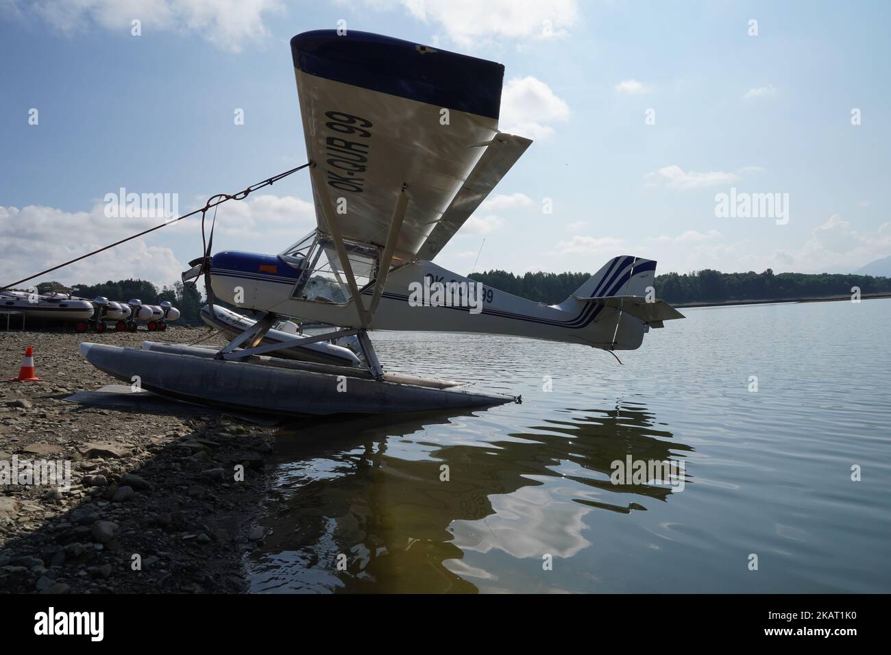 Side view on floatplane or seaplane with two slender floats mounted ...