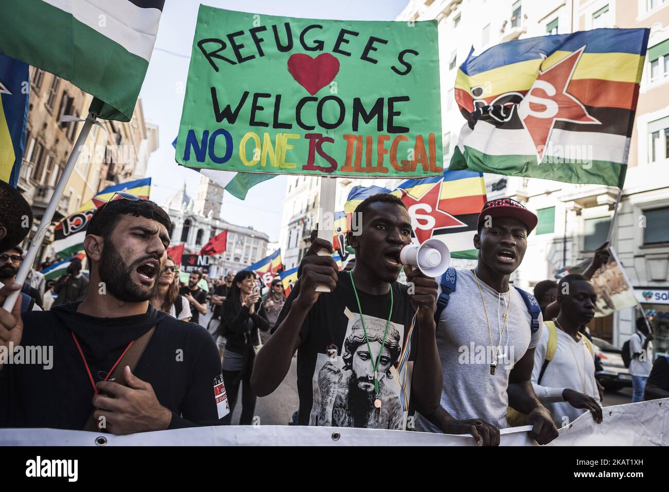 Refugees and asylum seekers march downtown during the 'Non è reato' (It ...