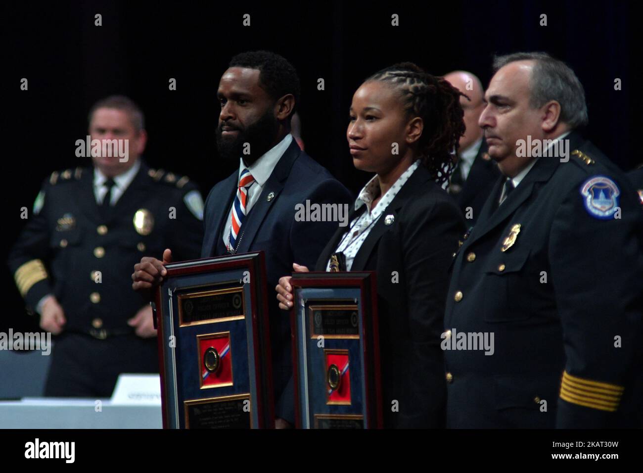 Recipients of Police Officer of the Year Awards are recognized on stage ...