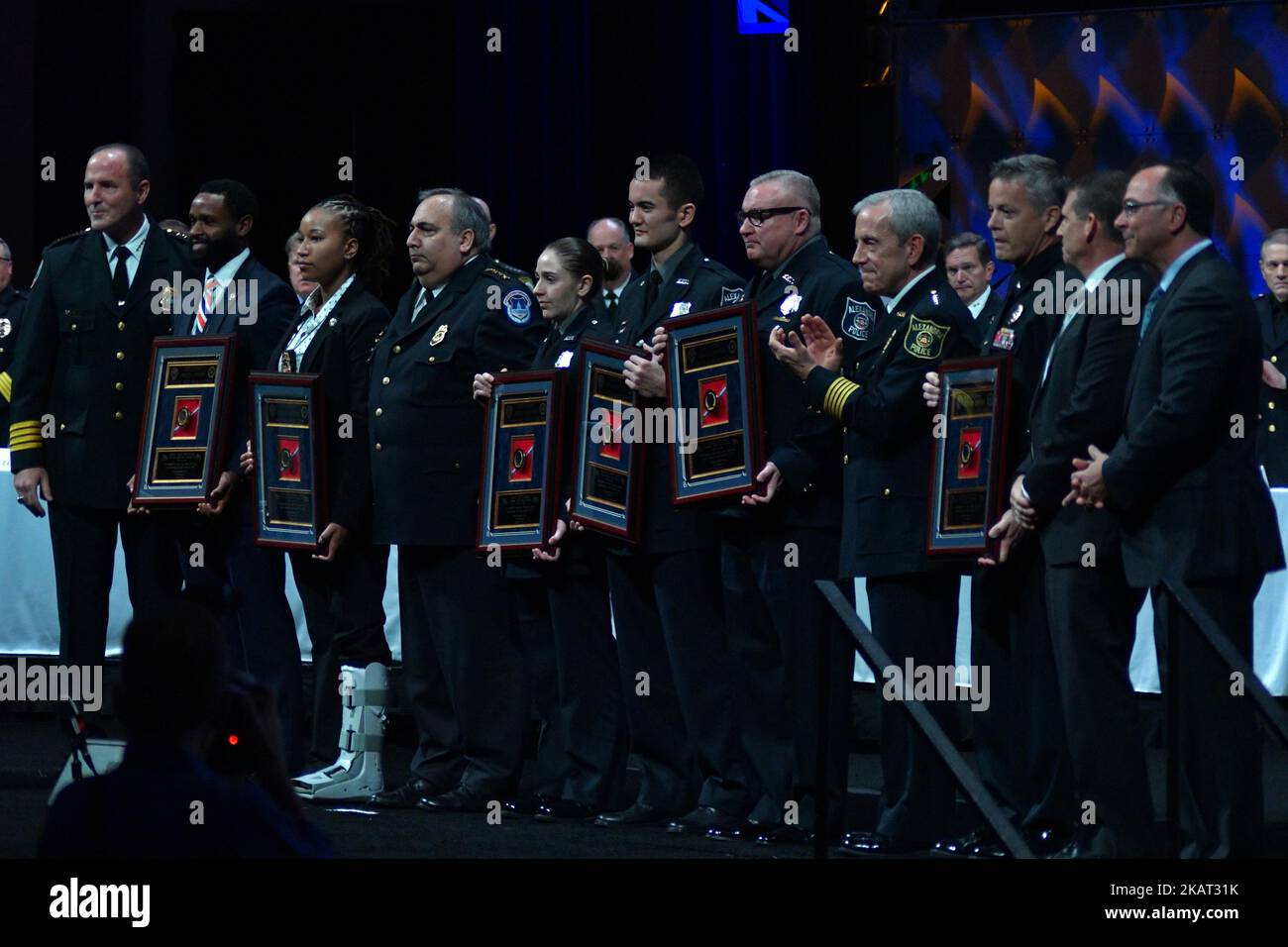 Recipients of Police Officer of the Year Awards are recognized on stage ...