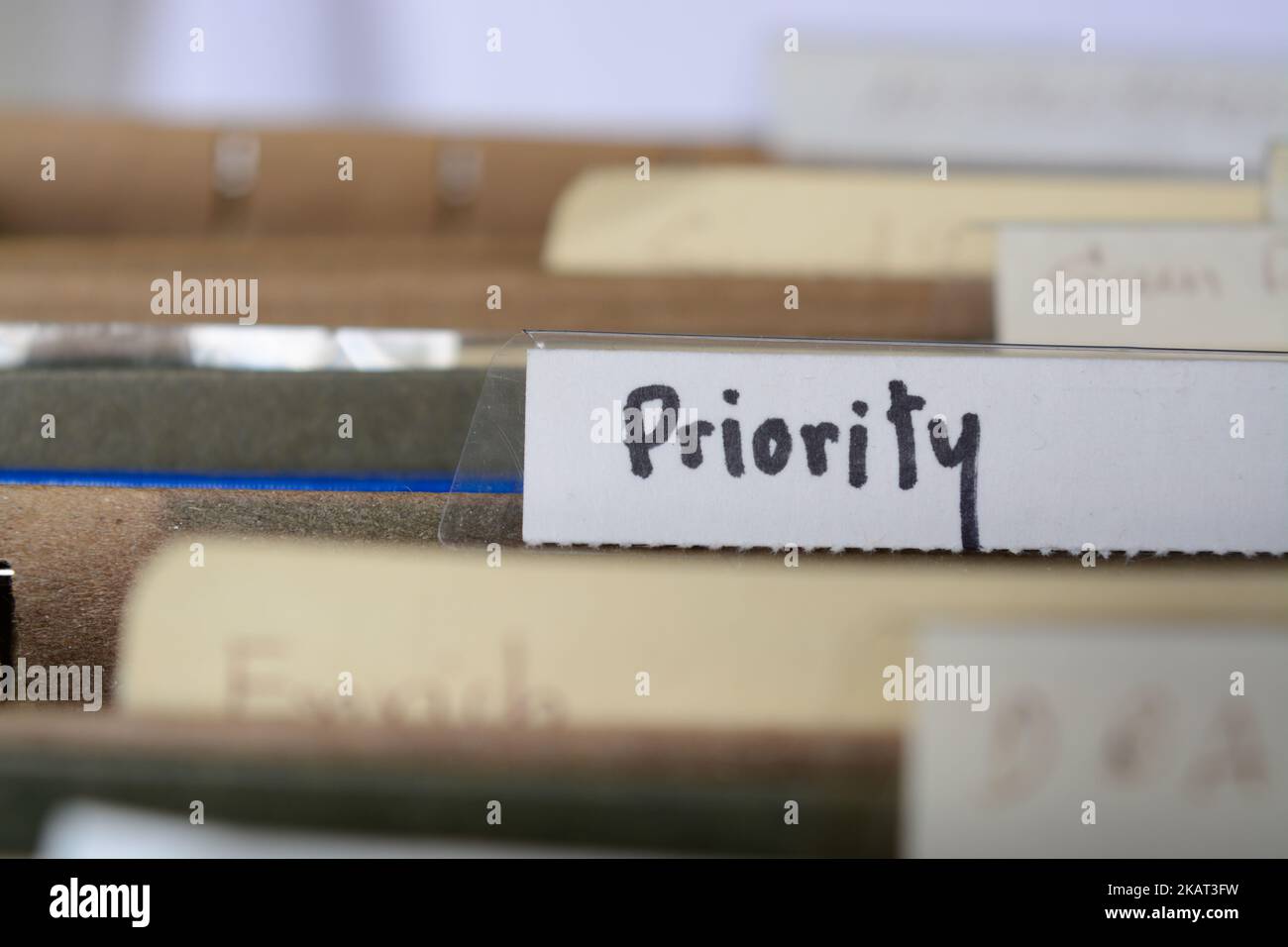 The office files and documents labeled as "priority Stock Photo - Alamy
