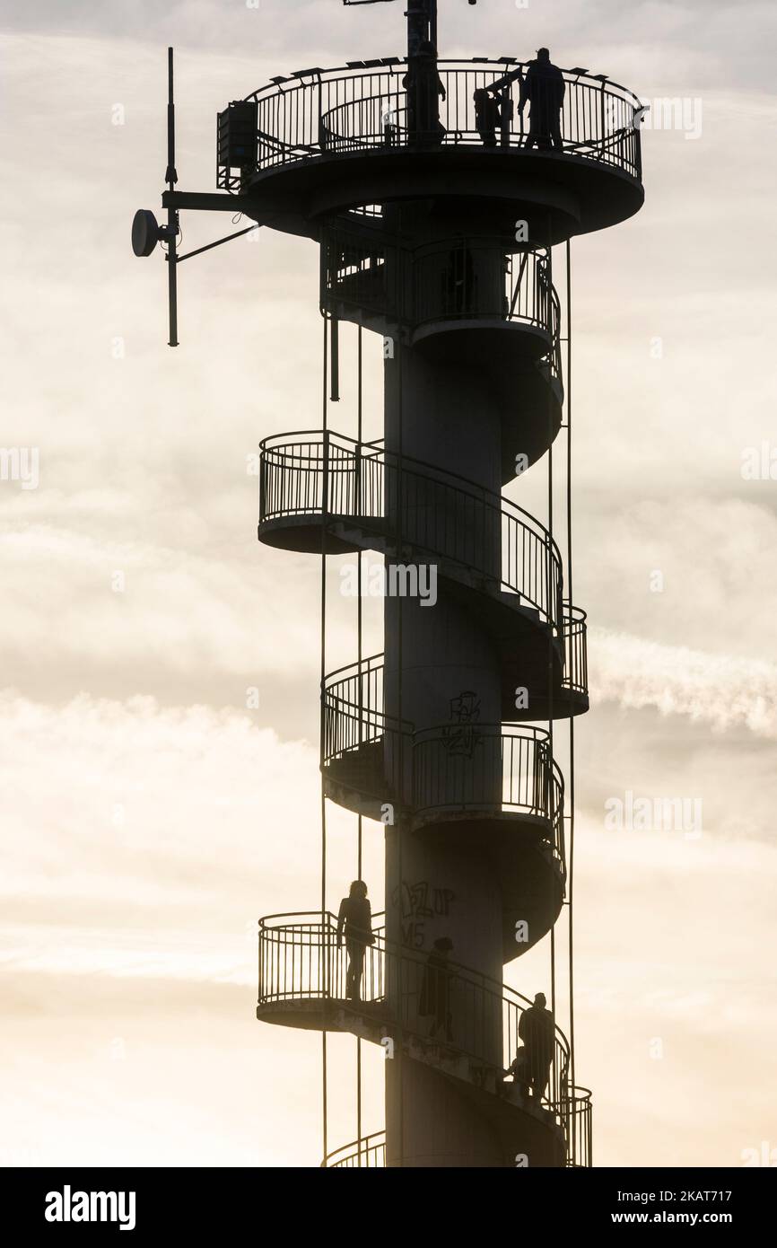 Wien, Vienna: people on observation tower Jubiläumswarte, backlit shot ...