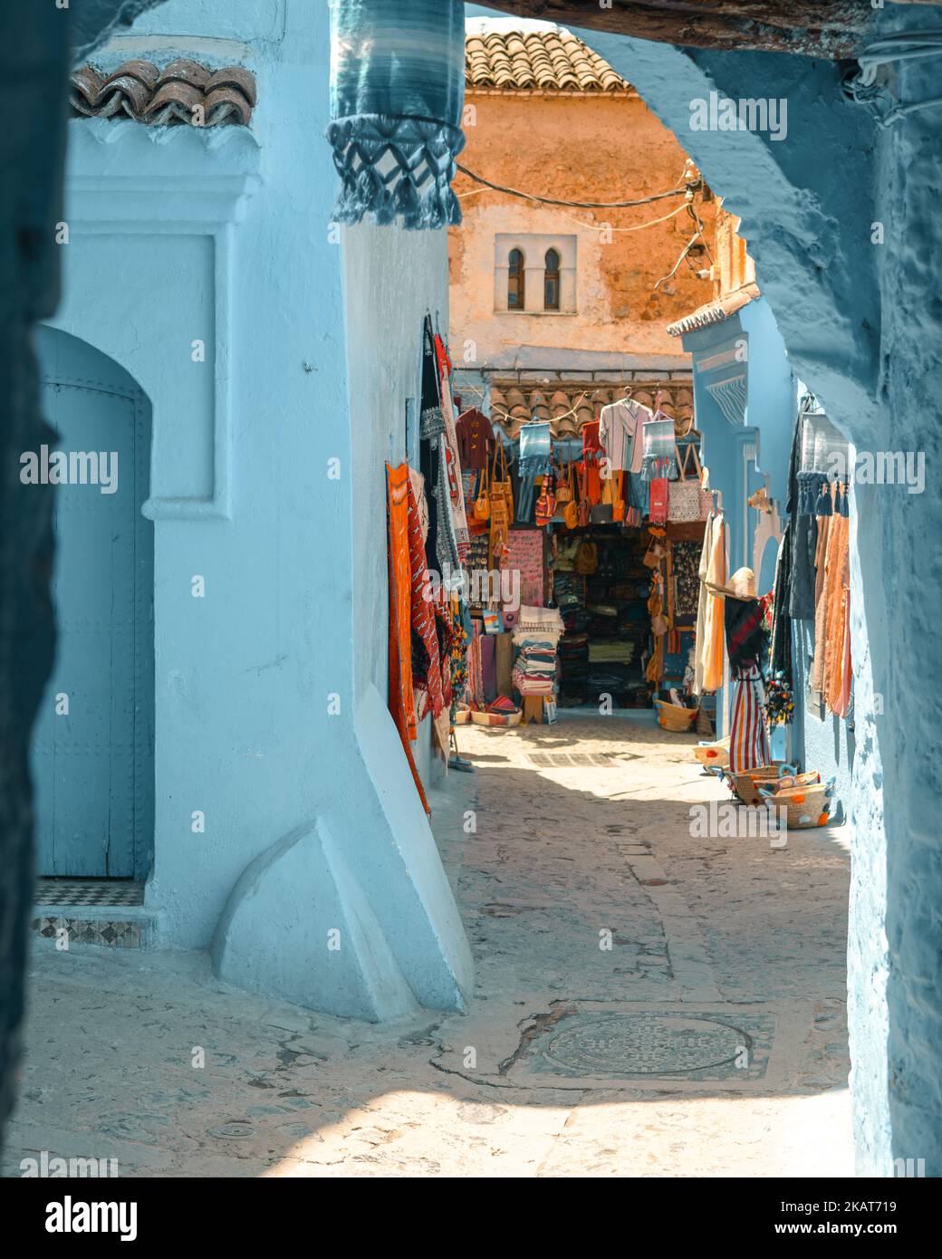 A narrow alley between beautiful blue-washed buildings in Chefchaouen ...
