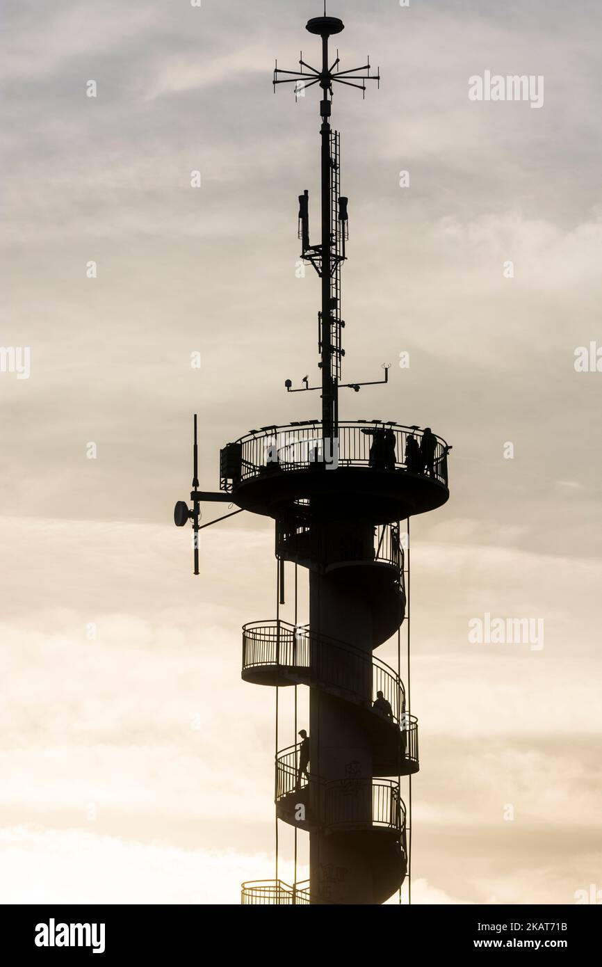 Wien, Vienna: people on observation tower Jubiläumswarte, backlit shot ...