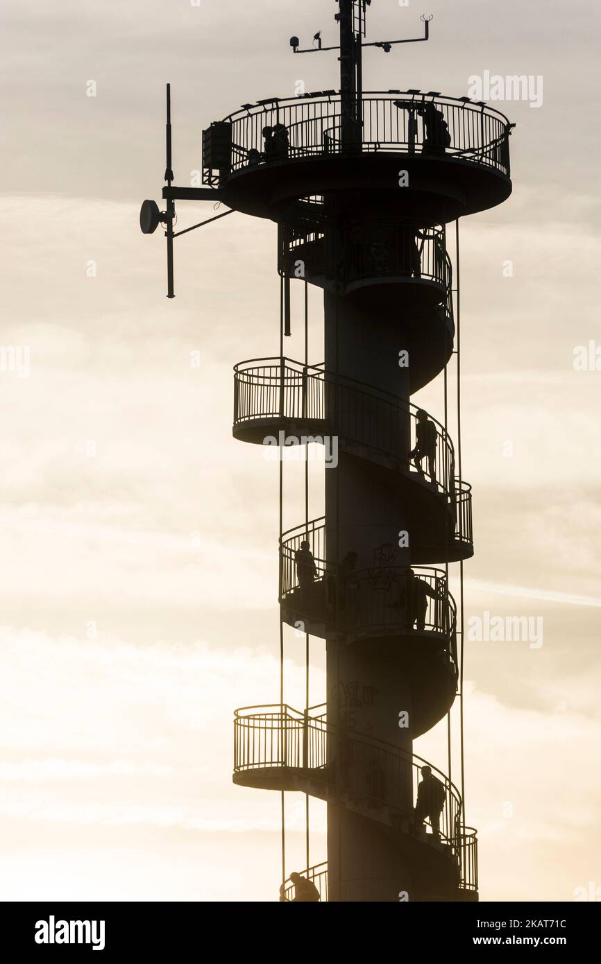 Wien, Vienna: people on observation tower Jubiläumswarte, backlit shot ...