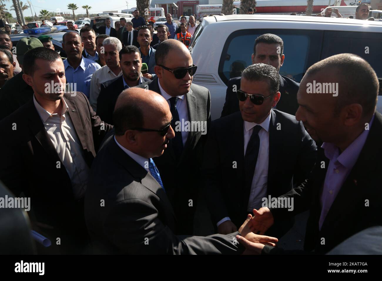 Palestinian Authority minister Mufeed al-Husayna (C-R) and Hammam Abu ...
