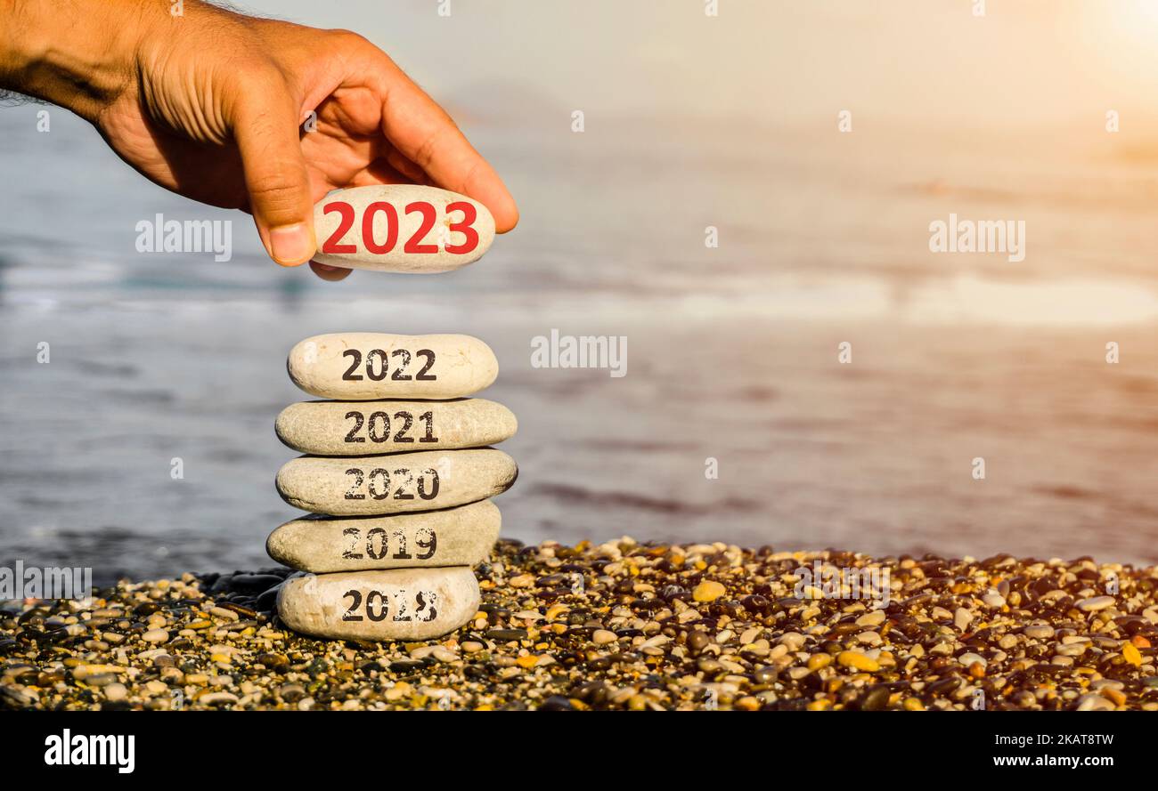 Happy new year 2023 replace old 2022. New Year 2023 is coming concept idea on beach. Creative ...