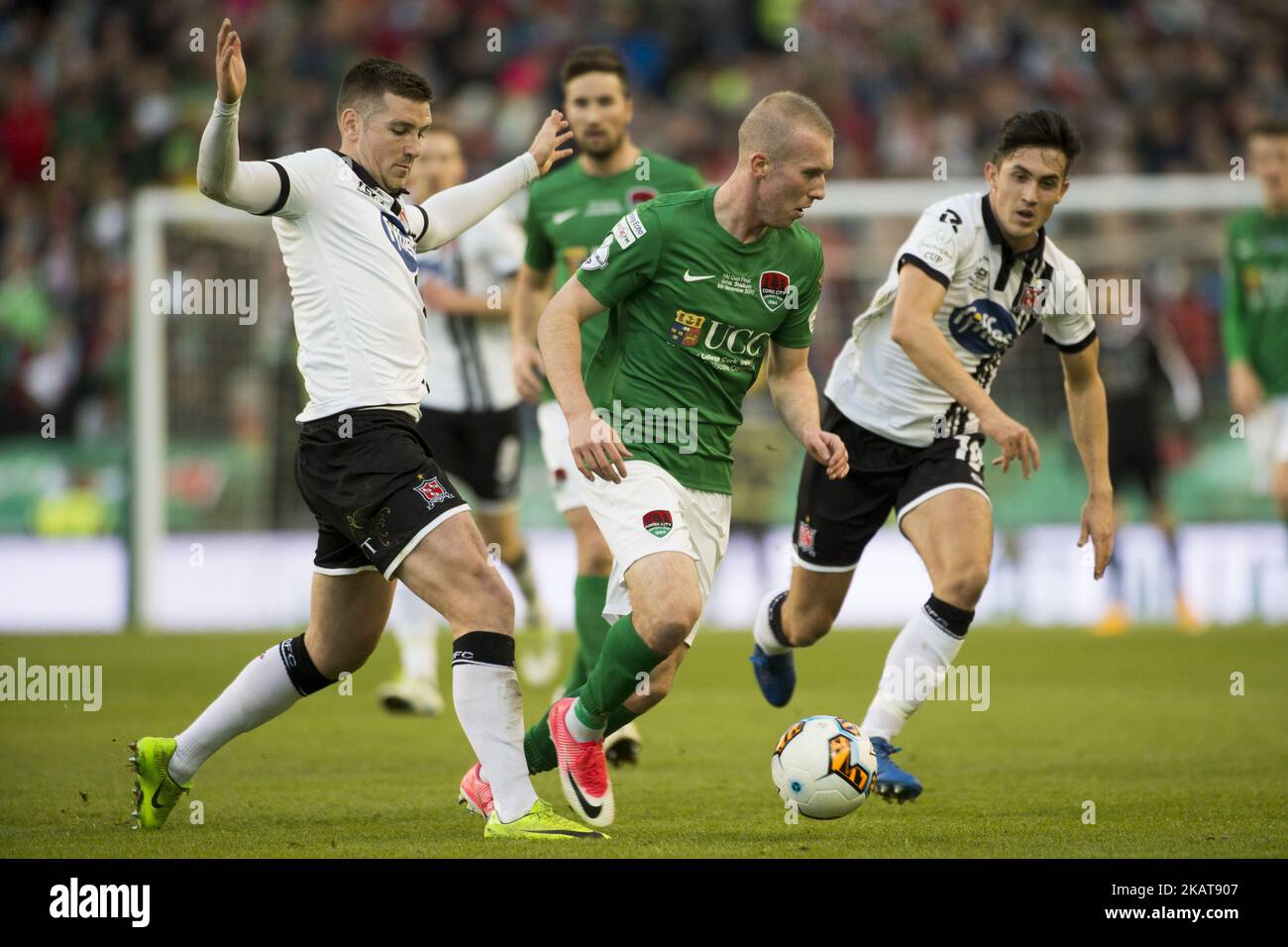 Stephen Dooley of Cork fights for the ball with Patrick McEleney and ...