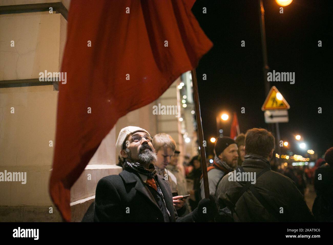 Russian Communist supporters carry red flags and shout slogans as they ...