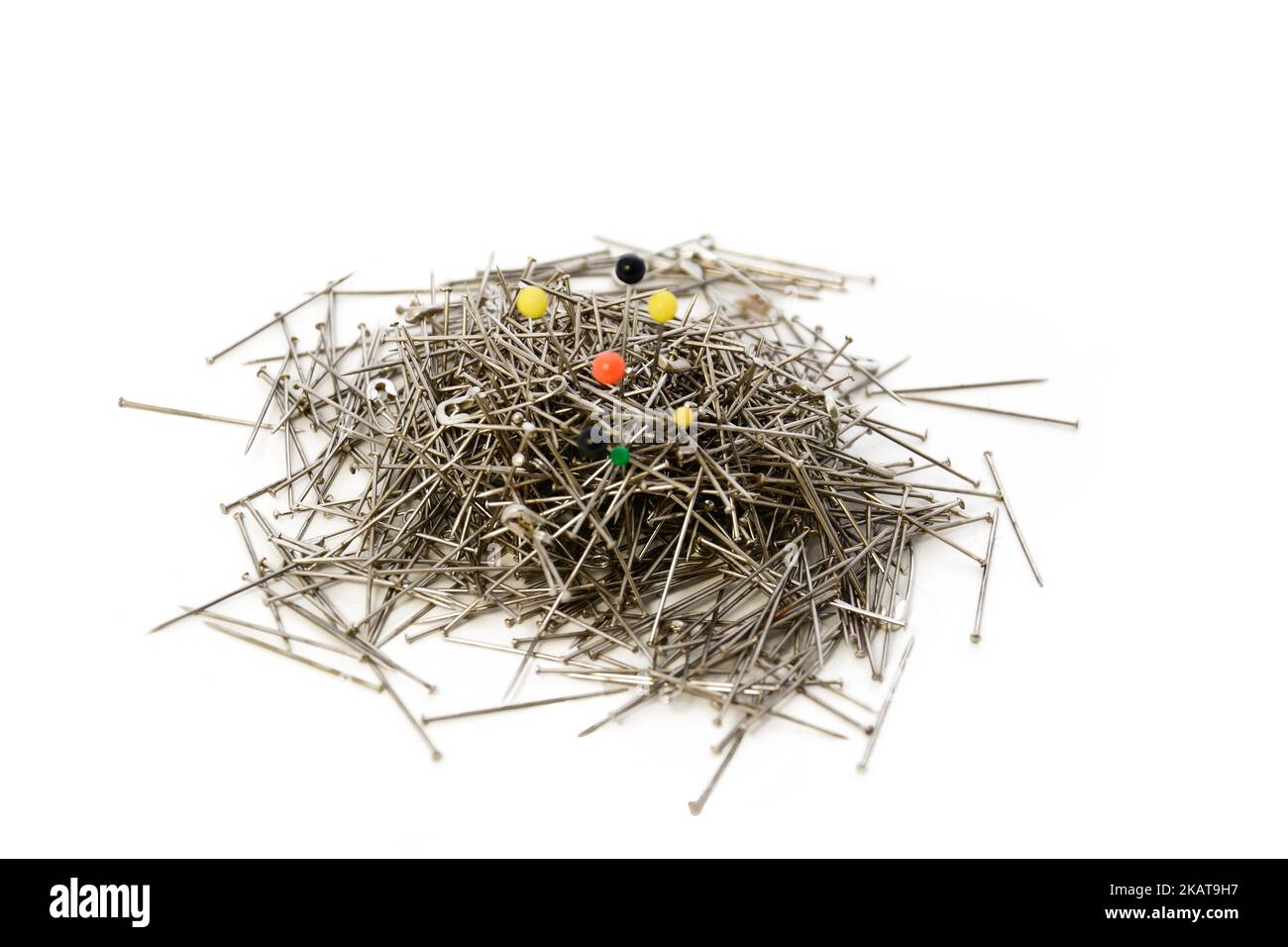 A pile of Garment pins on the white background Stock Photo - Alamy