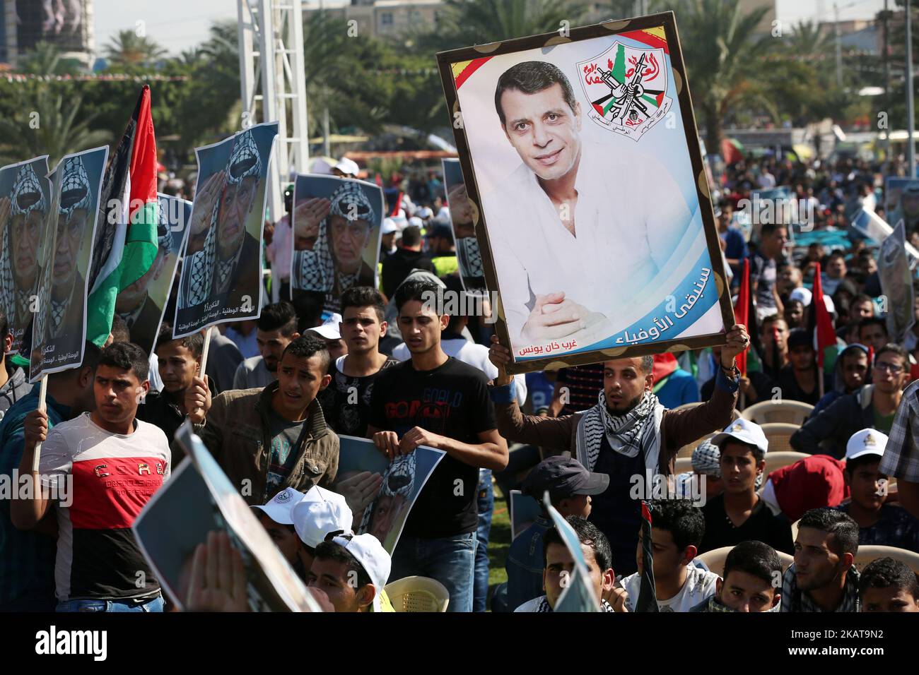 PalestinianS hold pictures of late leader Yasser Arafat in Gaza City on ...
