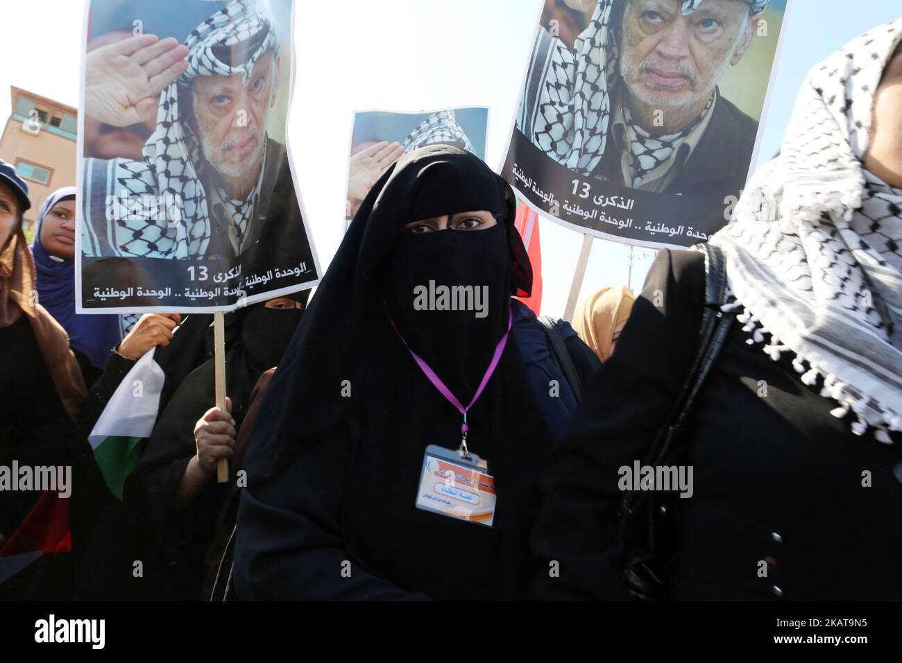 PalestinianS hold pictures of late leader Yasser Arafat in Gaza City on ...