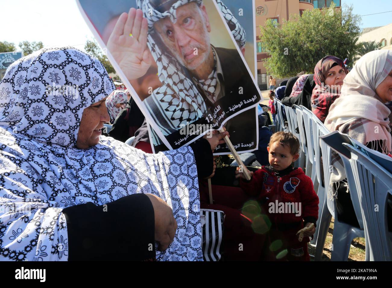 PalestinianS hold pictures of late leader Yasser Arafat in Gaza City on ...
