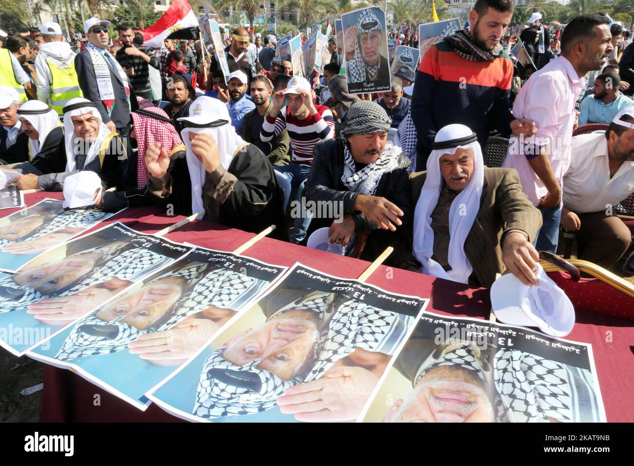 PalestinianS hold pictures of late leader Yasser Arafat in Gaza City on ...