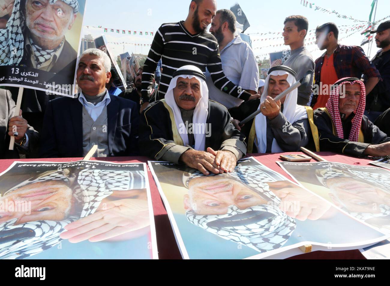 PalestinianS hold pictures of late leader Yasser Arafat in Gaza City on ...