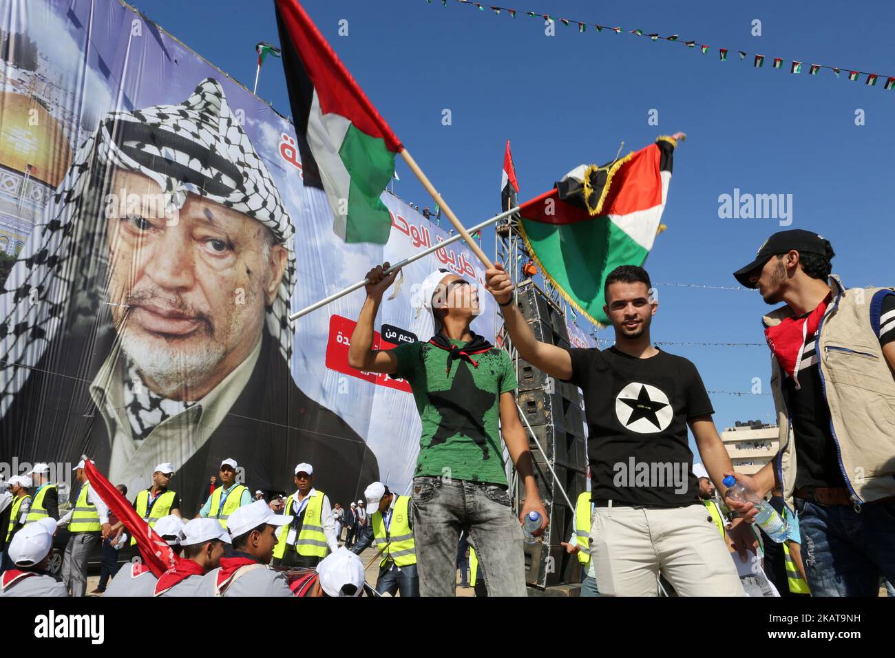 PalestinianS hold pictures of late leader Yasser Arafat in Gaza City on ...