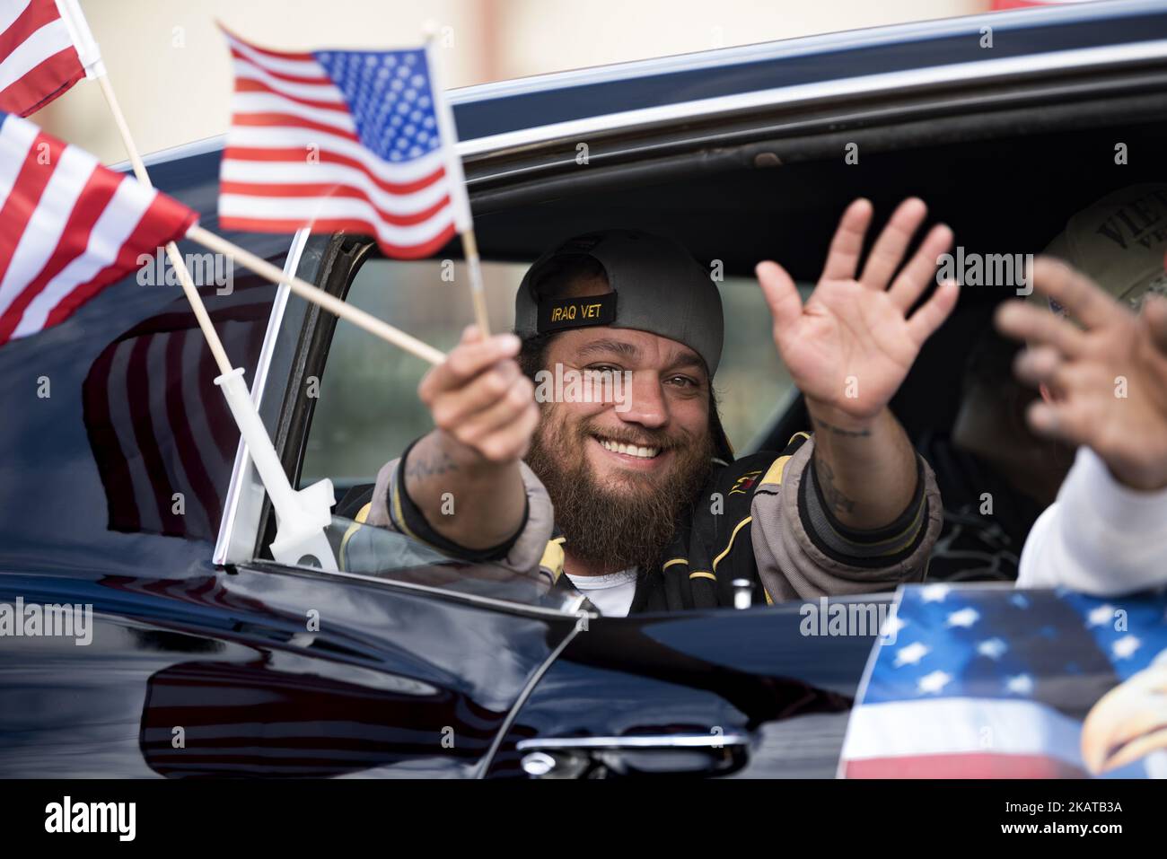 Iraq War veteran waves to the crowd during the San Fernando Valley ...