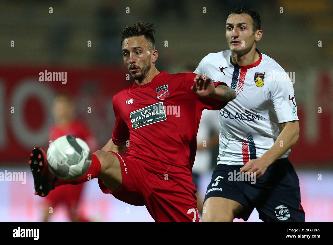 Antonio Bacio Terracino of Teramo Calcio 1913 compete for the ball ...
