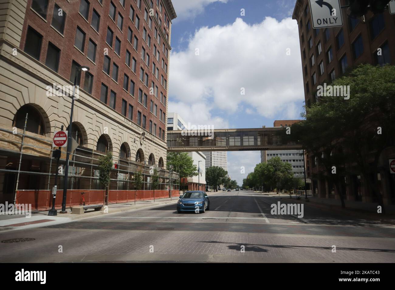 The view of a sky bridge connecting two buildings on a street in ...