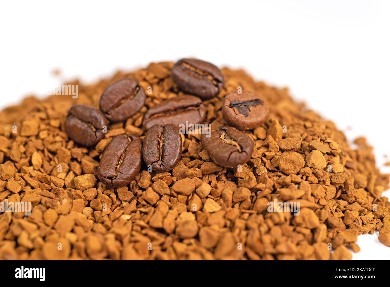 Instant coffee beans against a white background Stock Photo - Alamy