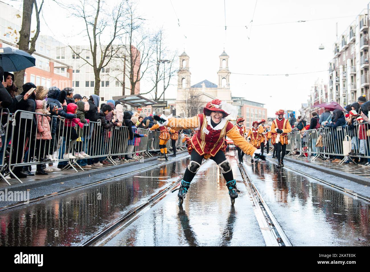 People attend the Saint Nicholas parade, in Amsterdam, Netherlands, on ...