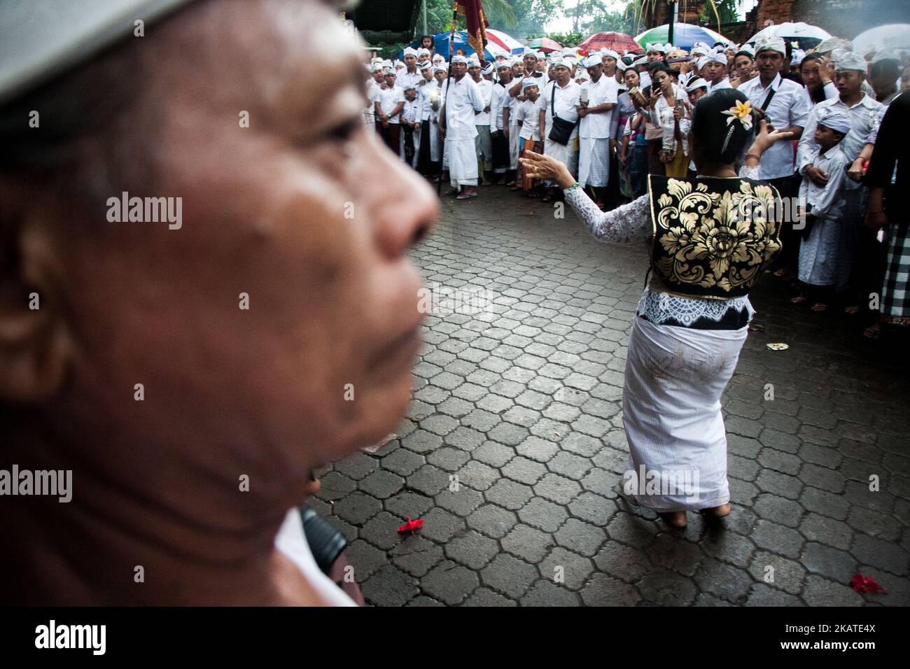 Balinese Hindus are performing rituals at the Pakraman Kesiman village ...