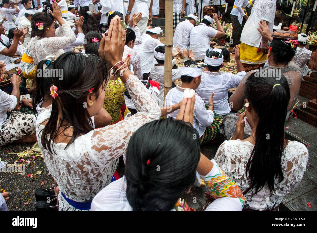 People are praying in a temple at Pakraman Kesiman village on November ...