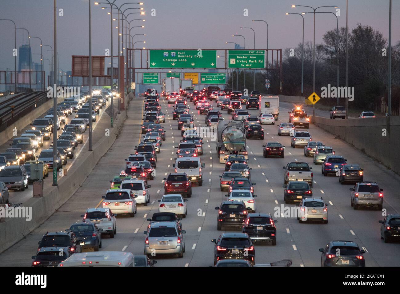 Masses of vehicles move slowly on the Montrose Ave overpass at the 1-90 ...