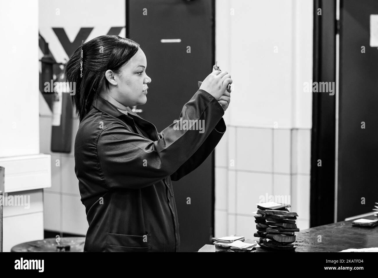 Female lab technician testing product samples in a rubber factory Stock ...