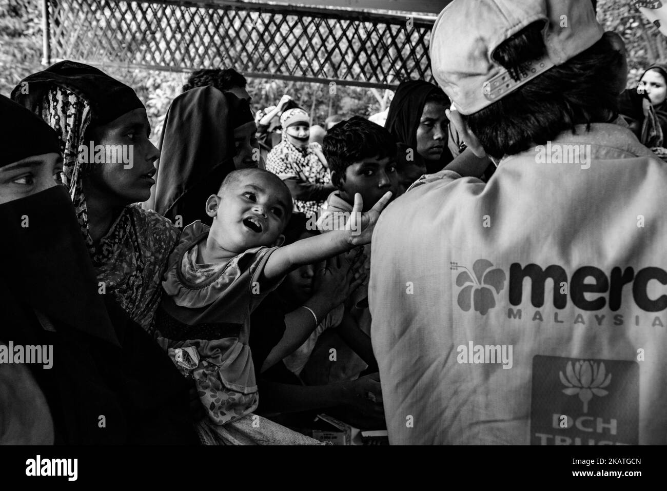 The Rohingya refugee baby begs for medical help in a field clinic by ...