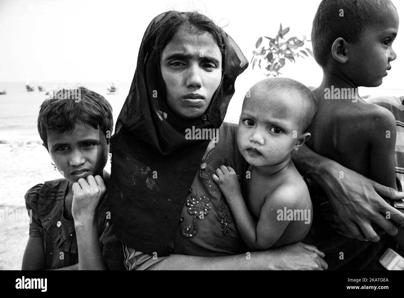 A newly arrived Rohingya refugee family after arriving at Shah Porir ...