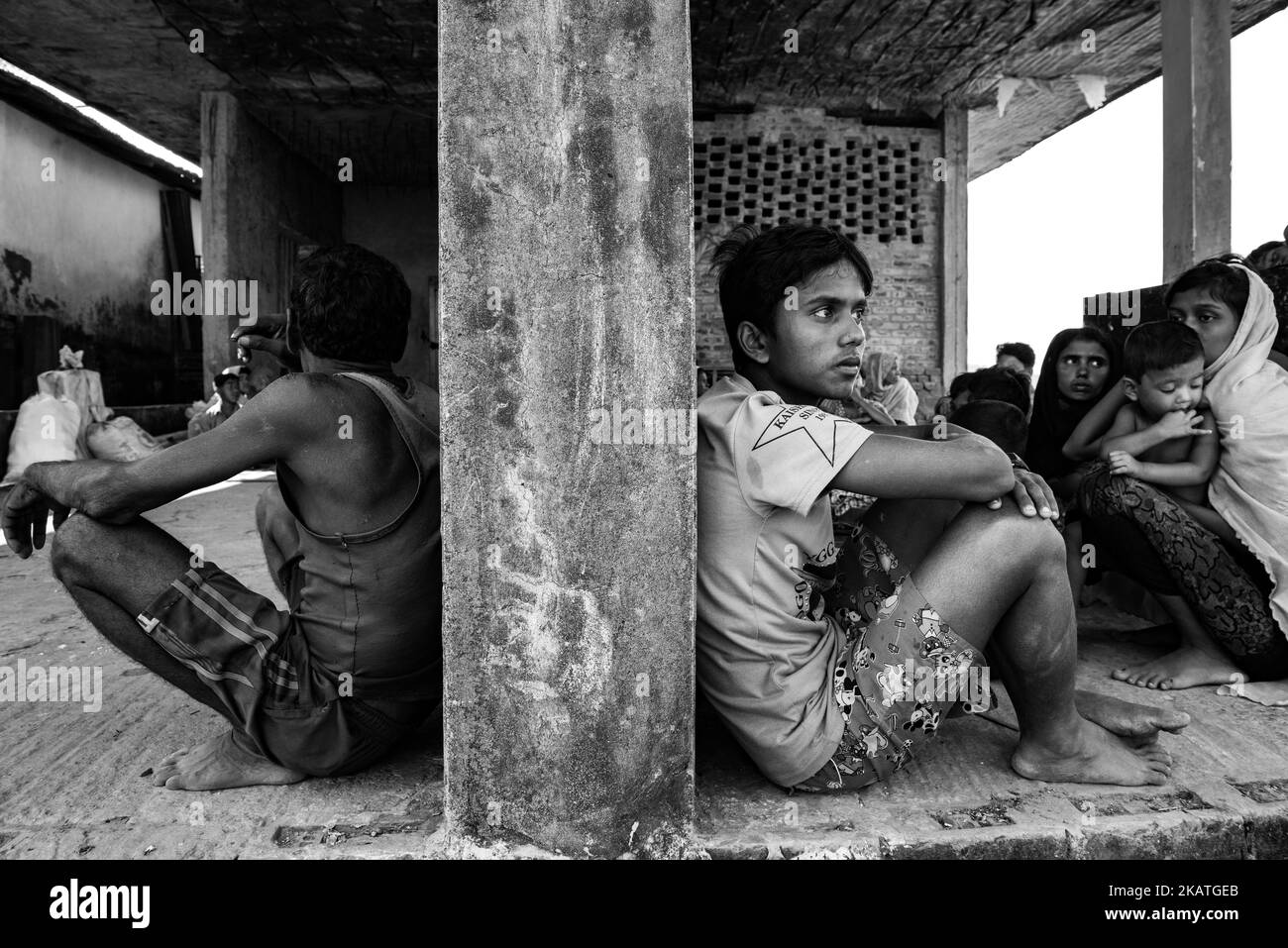 Rohingya refugees rest in temporary shelter after arriving by boat to ...