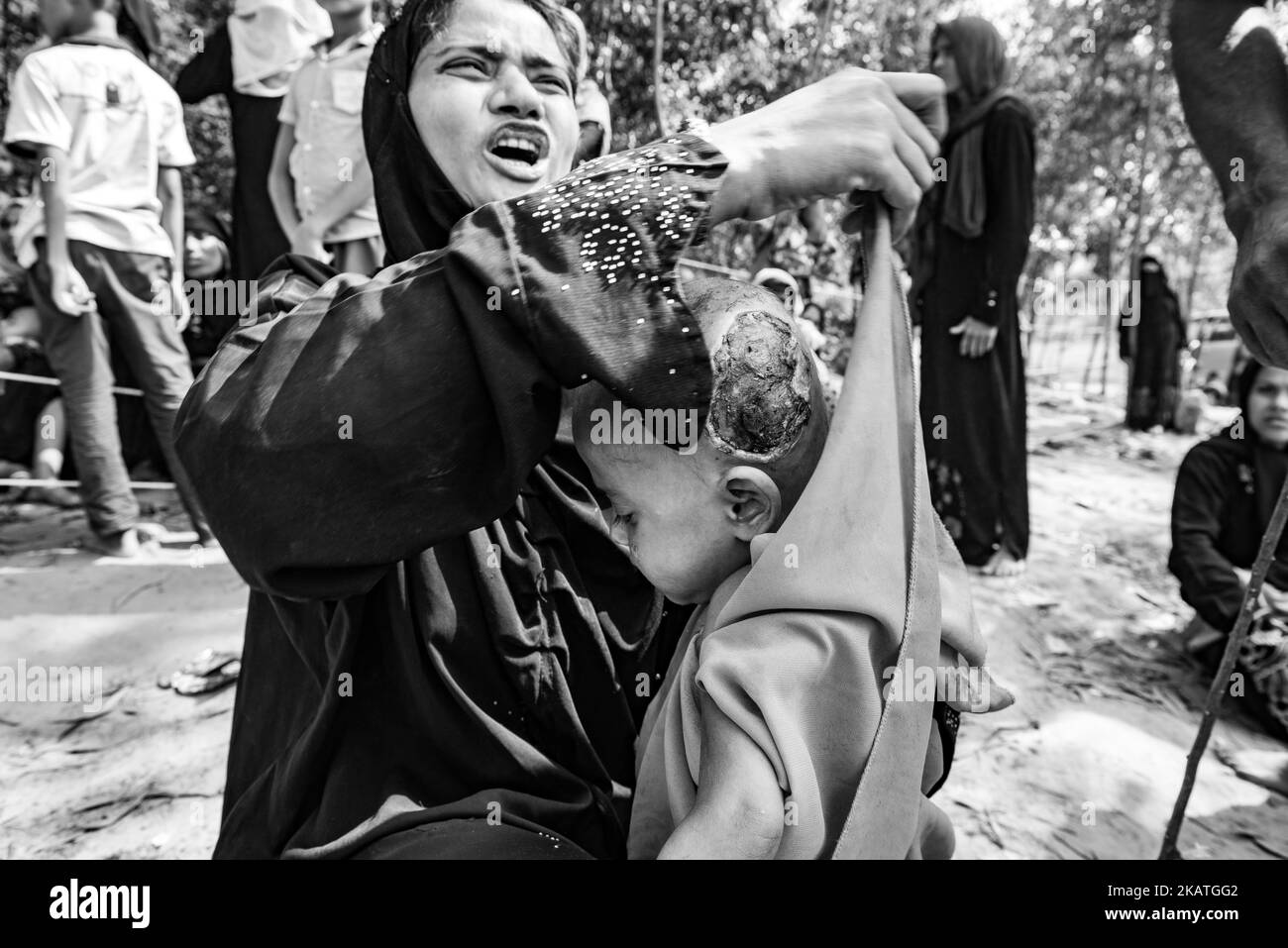 Rohingya refugee, 22-year-old Asmida Akter holds her three months old ...