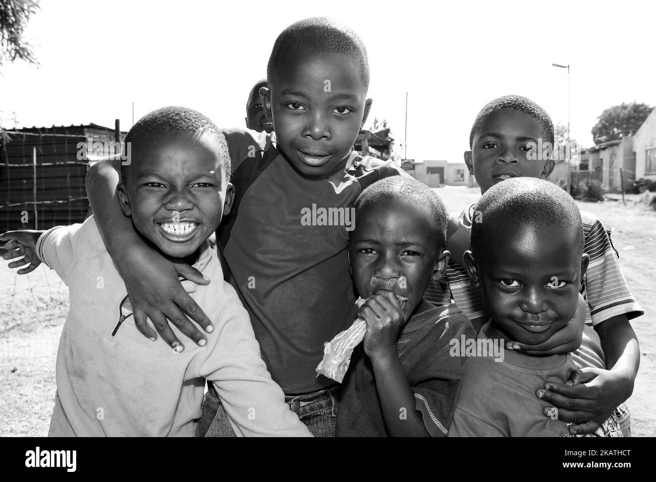 Small group of young African children posing for a photo and displaying ...
