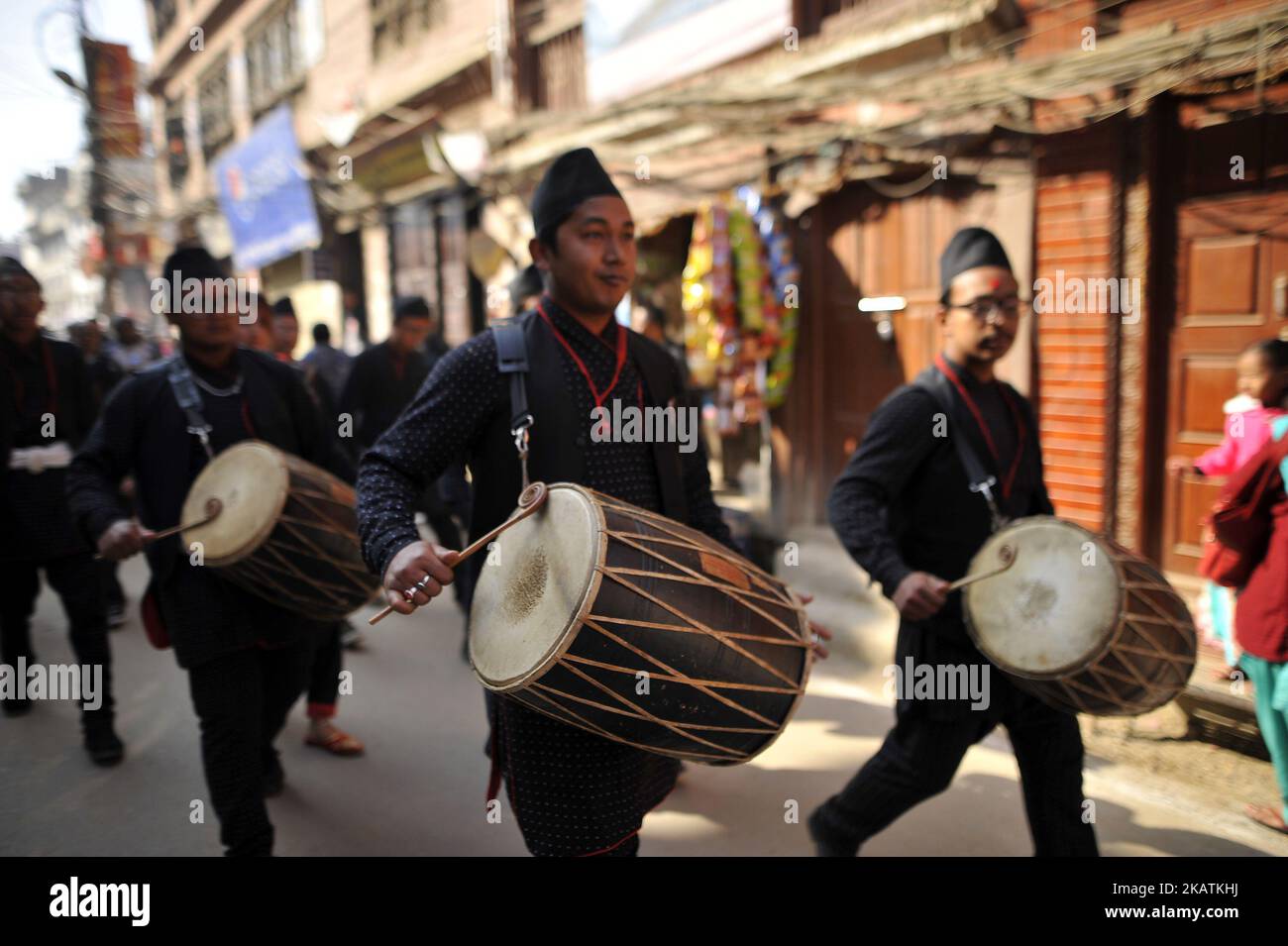 People from Newar community play traditional instruments during a ...