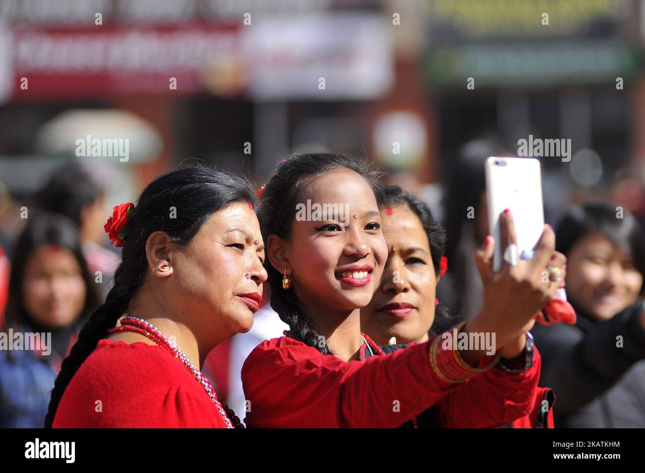 People from Newar community in a traditional attire taking selfie from ...