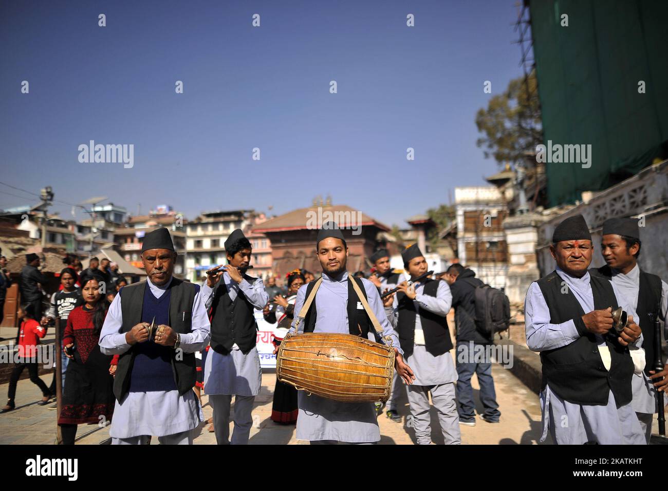 People from Newar community play traditional instruments during a ...