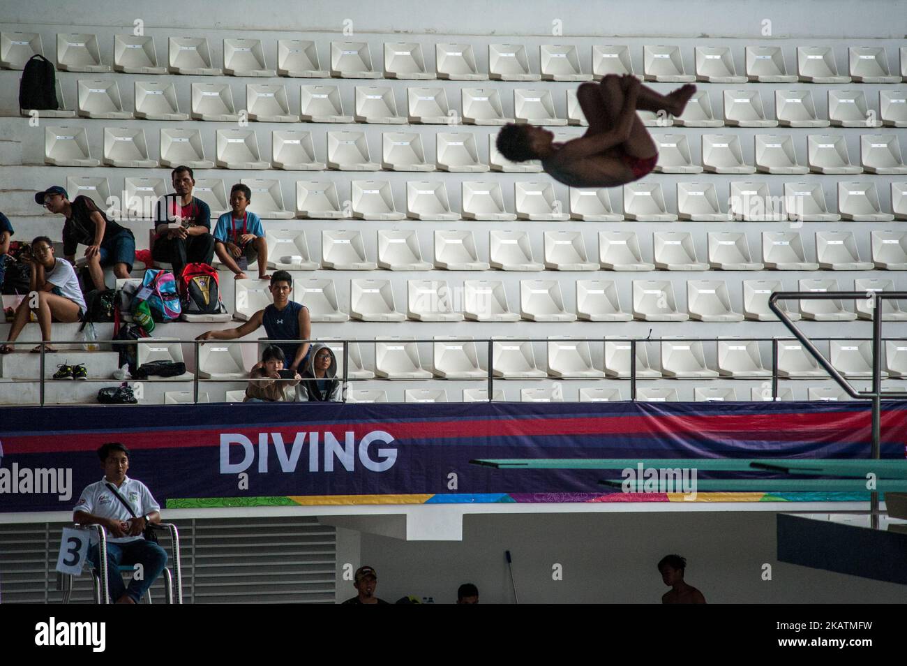 An athlete jumps in Indonesia Open Aquatic Championship (IOAC) at the ...
