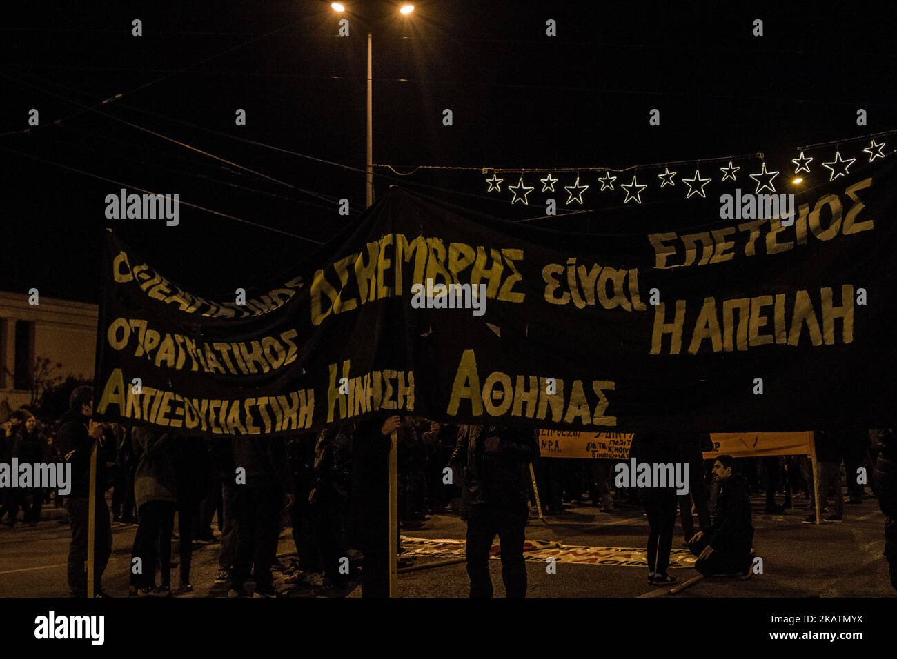 Protesters march shouting slogans against the state and the police ...