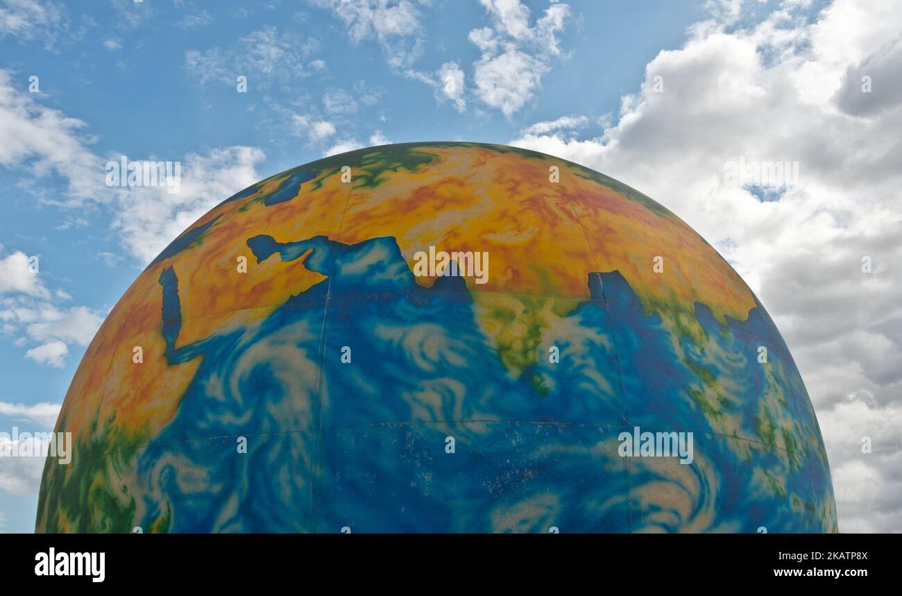 Earth globe and cloudy sky Stock Photo - Alamy