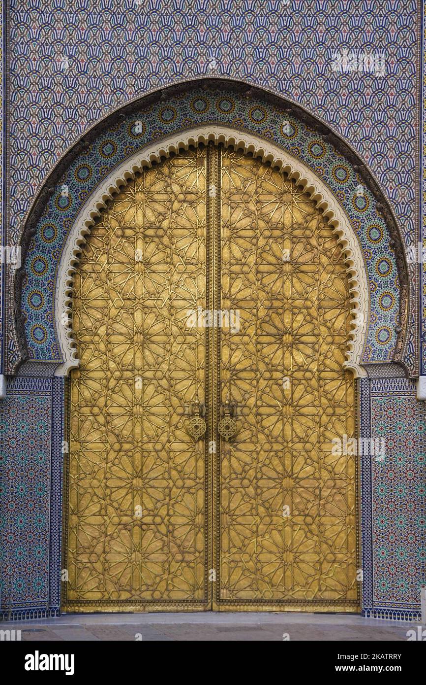 The entrance with the golden gates in the old Royal Palace in Fez ...