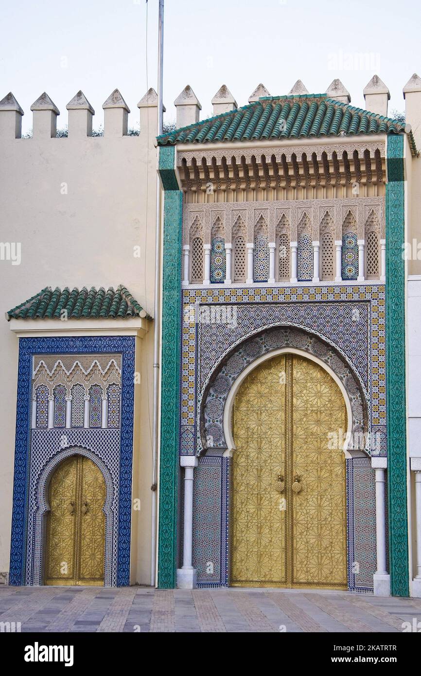 The entrance with the golden gates in the old Royal Palace in Fez ...