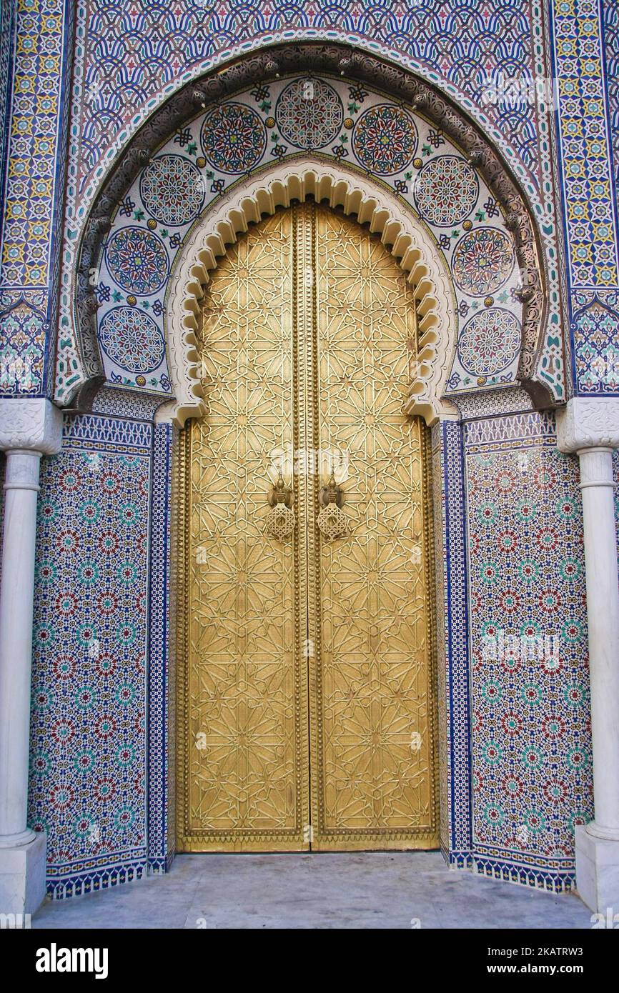 The entrance with the golden gates in the old Royal Palace in Fez ...