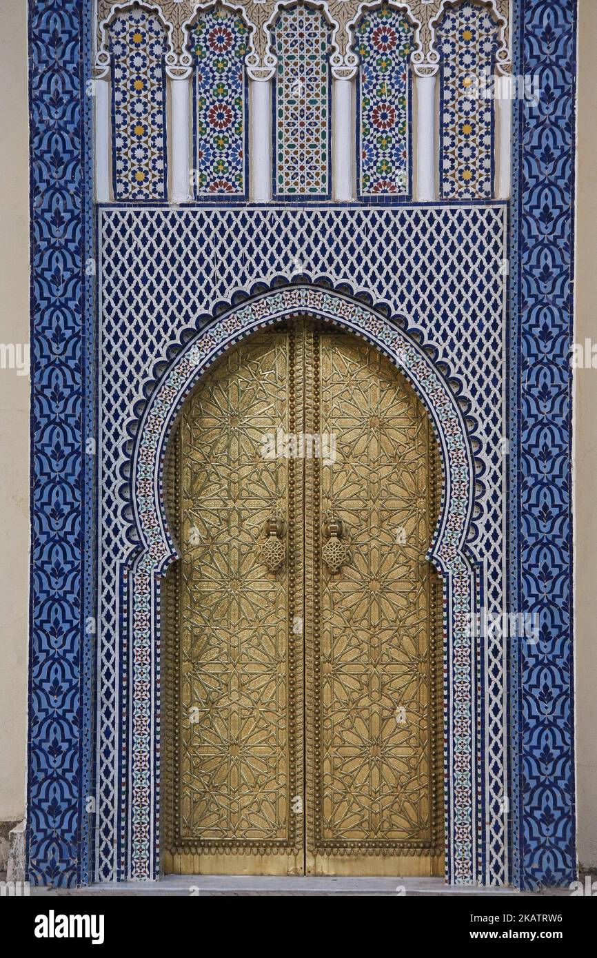 The entrance with the golden gates in the old Royal Palace in Fez ...