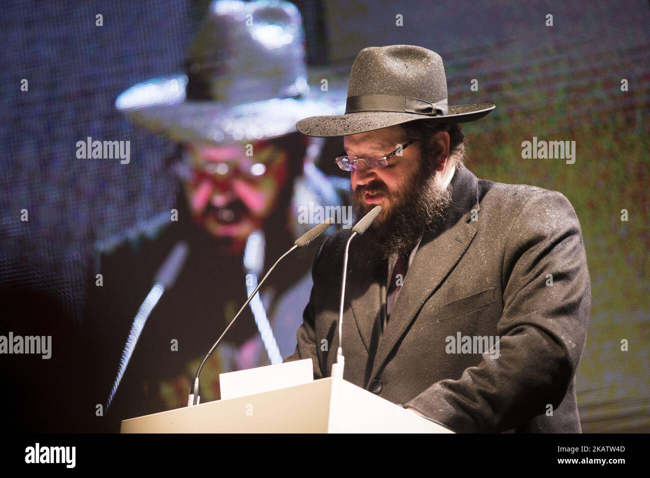 Rabbi Yehuda Teichtal speaks during a Hanukkah menorah public lighting ...